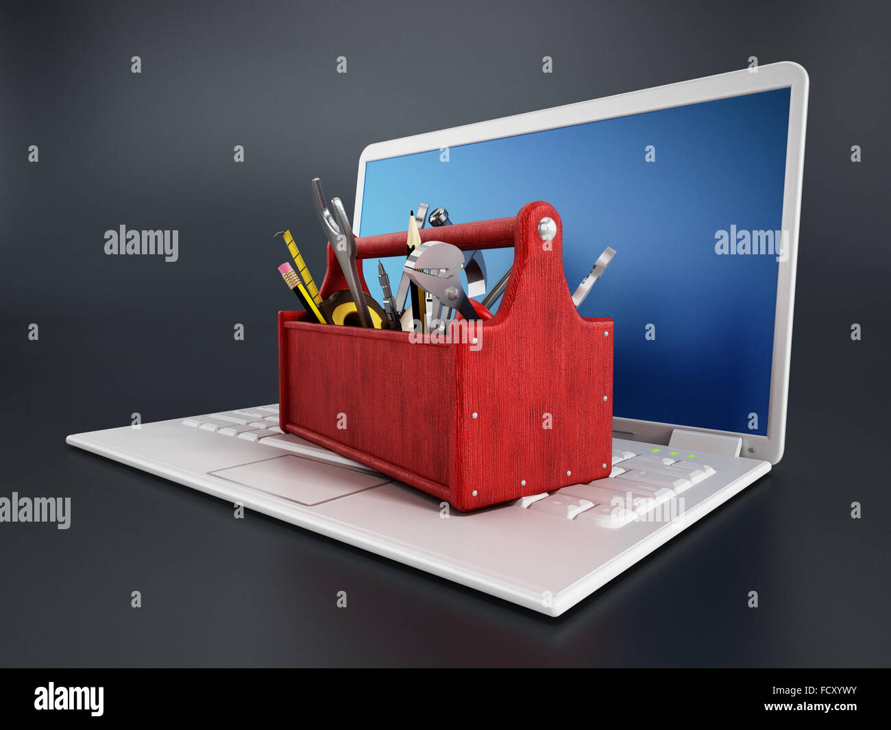 Red toolbox standing on laptop computer isolated on black background ...