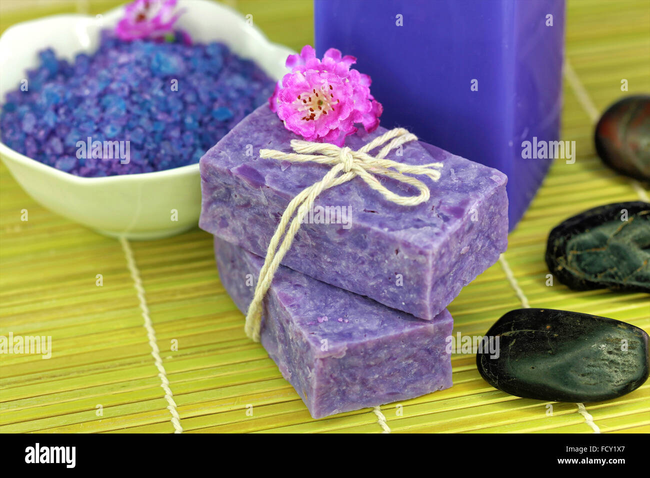 Spa treatment setting with purple theme Stock Photo - Alamy