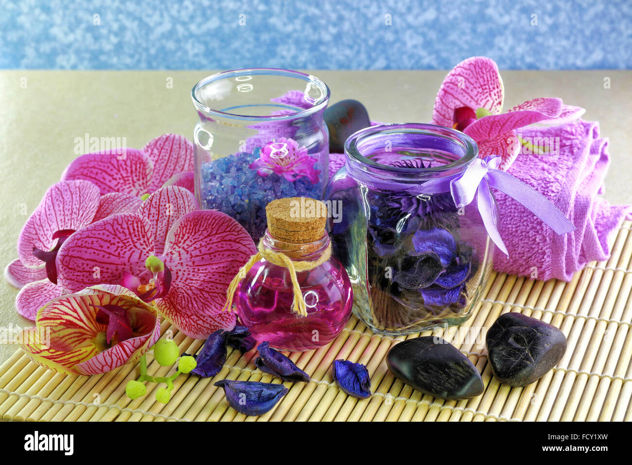 Spa treatment setting with purple theme Stock Photo - Alamy