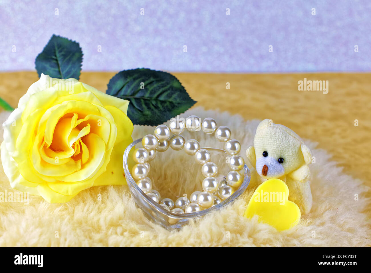 Yellow rose with ribbon Stock Photo - Alamy