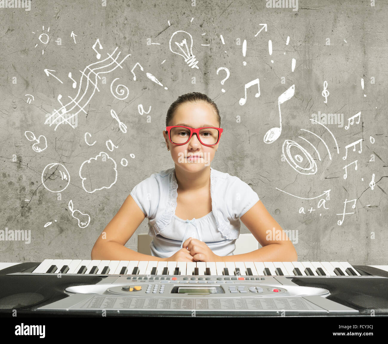 Pretty school girl in funny glasses playing piano Stock Photo - Alamy