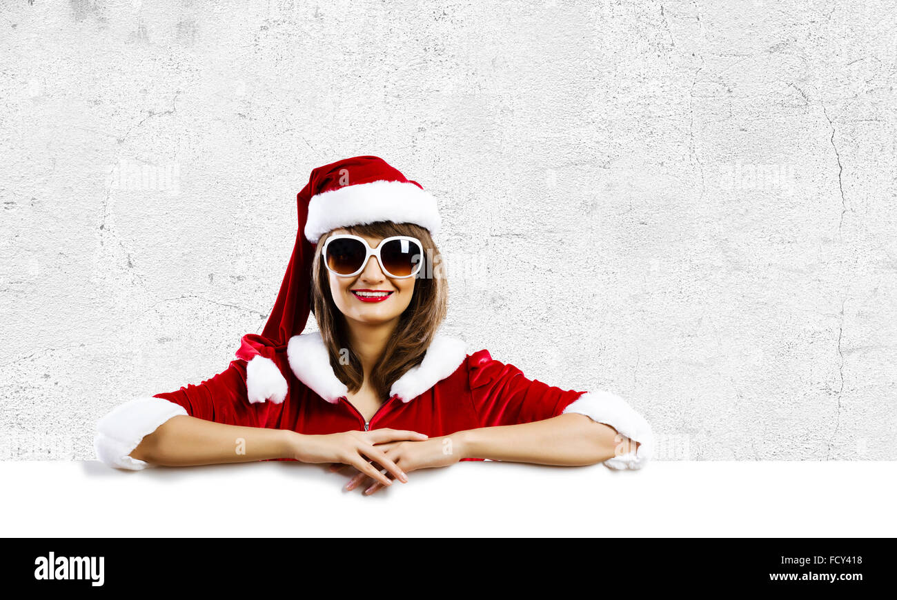Girl in Santa costume with white blank banner. Place for text Stock ...