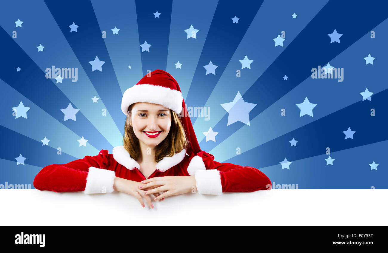 Girl in Santa costume with white blank banner. Place for text Stock ...