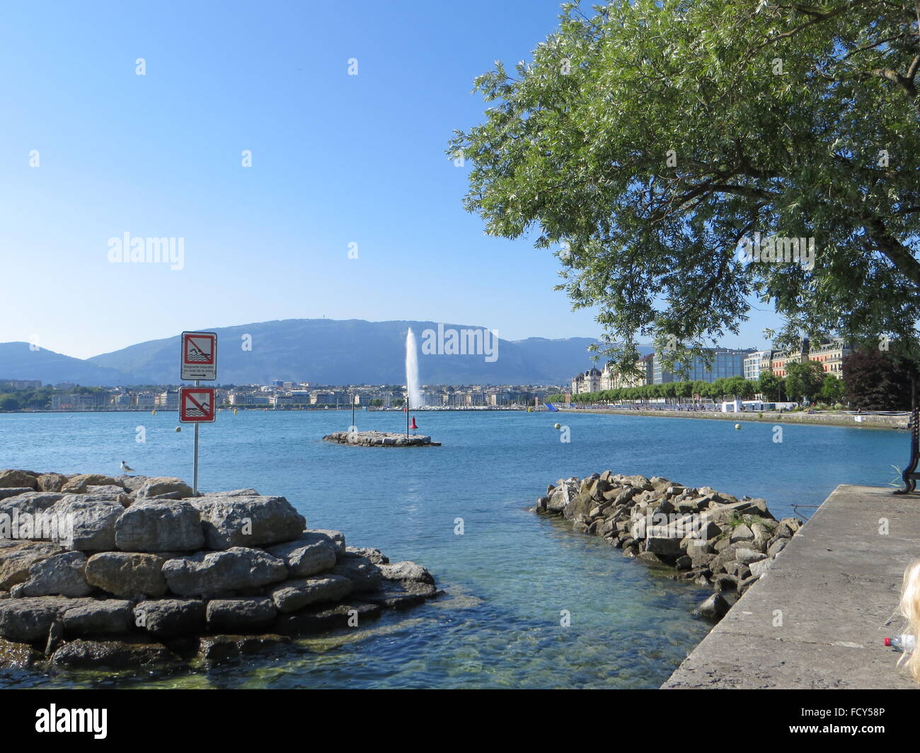 A scenic view across Lake Geneva towards the mountains and the Jet d ...