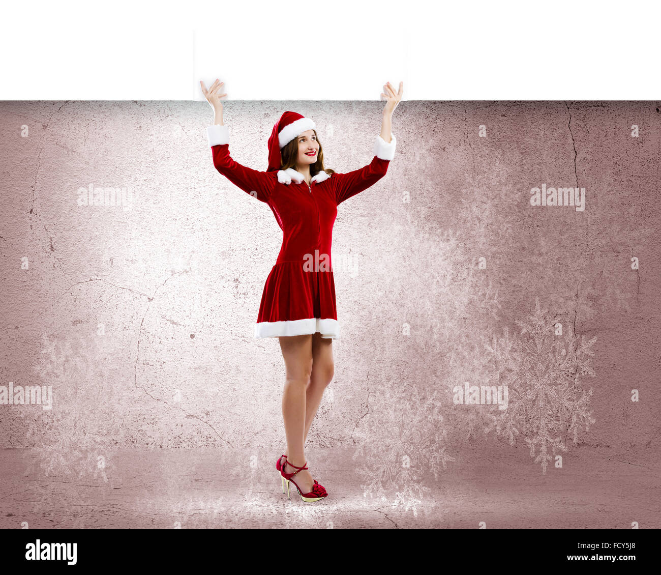 Girl in Santa costume with white blank banner. Place for text Stock ...