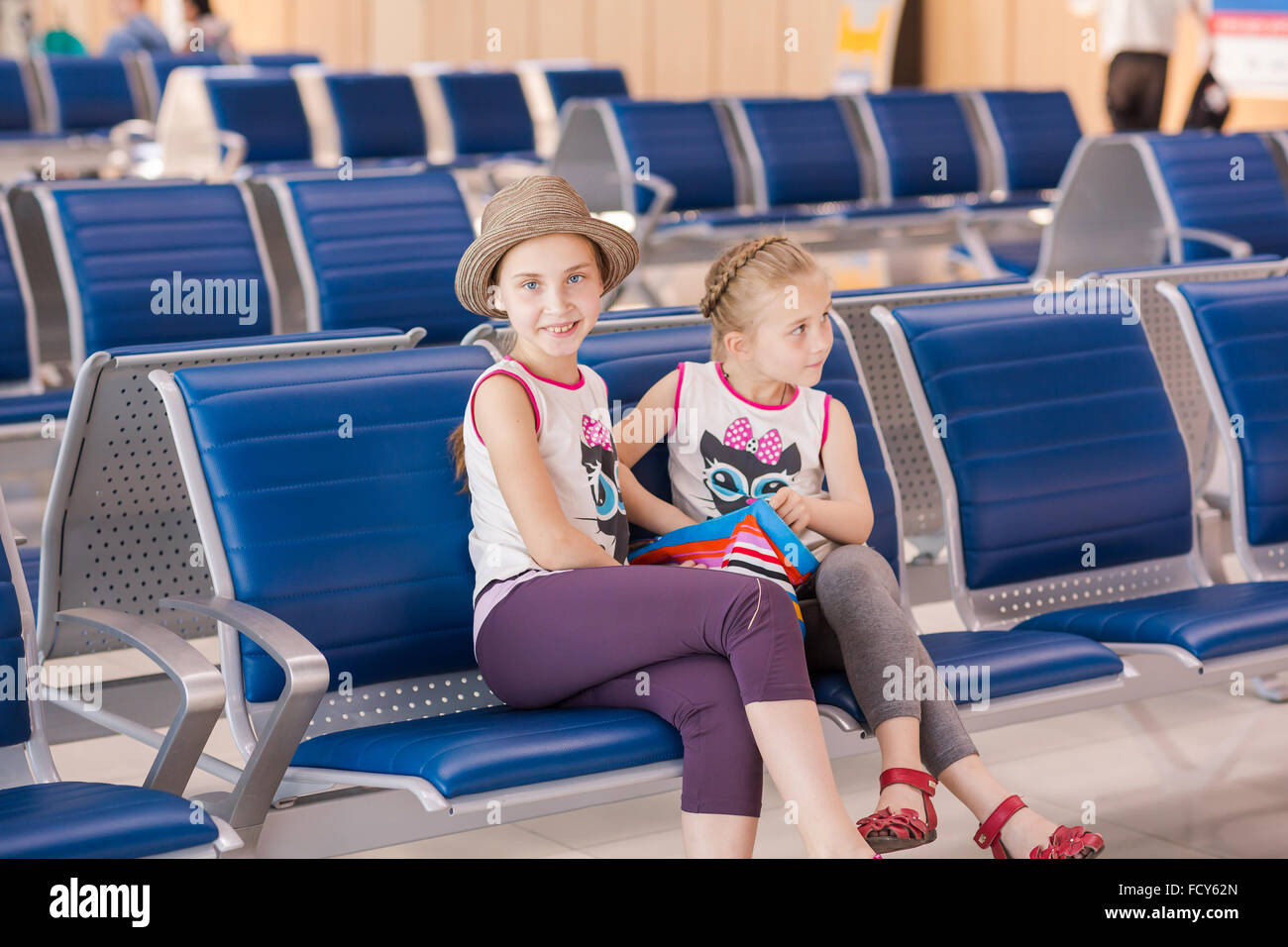 Happy kids waiting for flight inside international airport. Flight ...