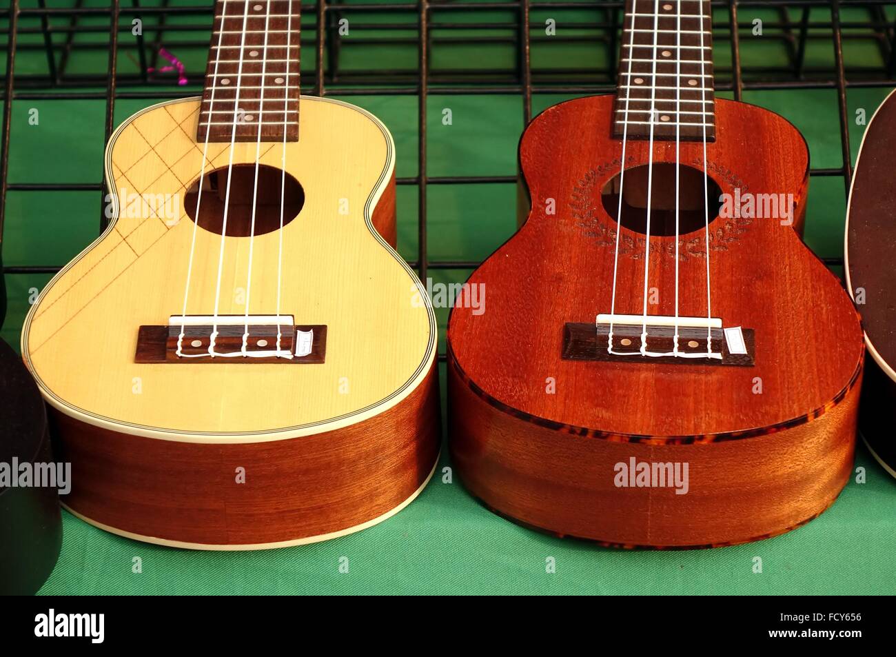 Ukuleles mini guitars on sale at an outdoor stall Stock Photo - Alamy