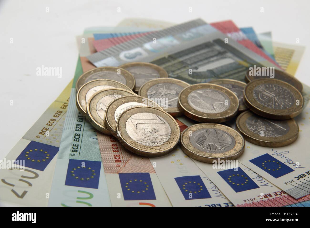 New Euro banknotes and coins Stock Photo - Alamy