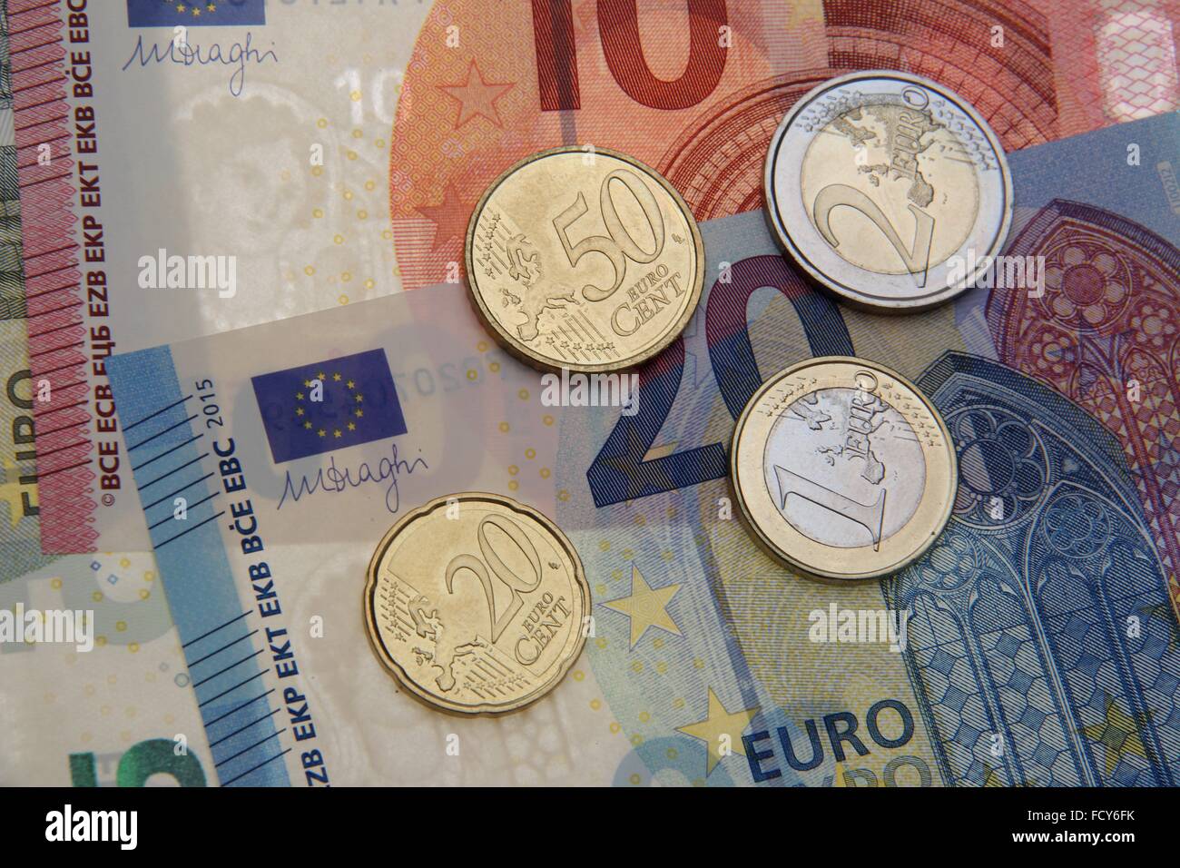 New Euro banknotes and coins Stock Photo - Alamy