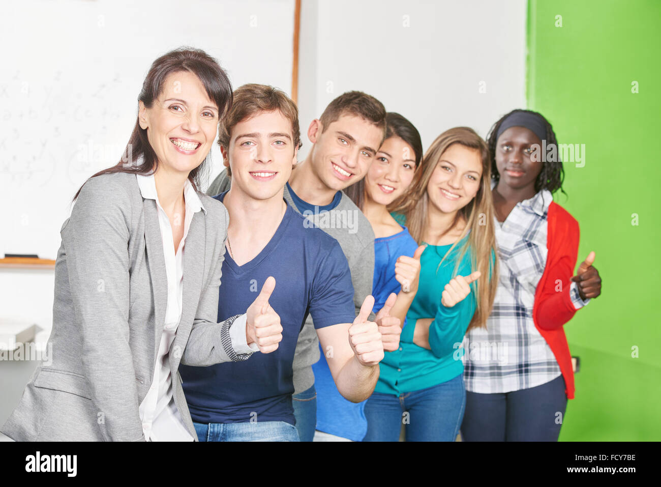 Students hands up classroom hi-res stock photography and images - Alamy