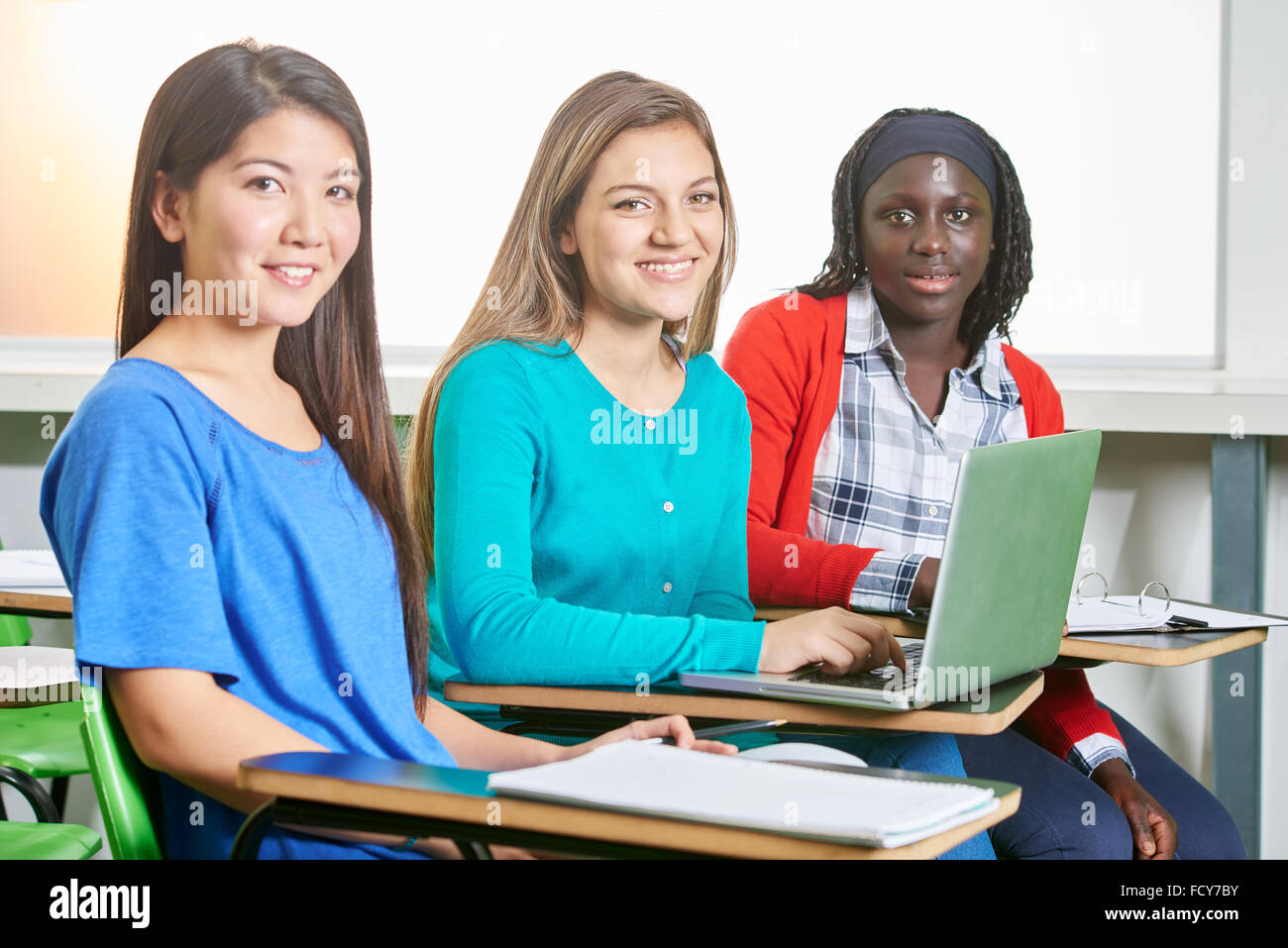 Interracial group of girls working in team at their high school Stock ...