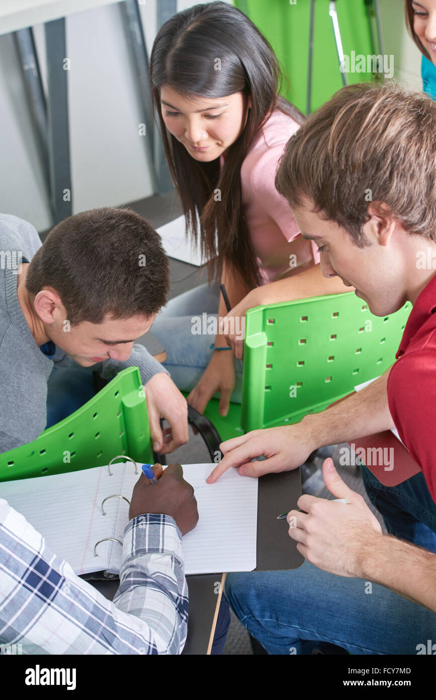 Teenager group of students doing teamwork at their high school Stock ...