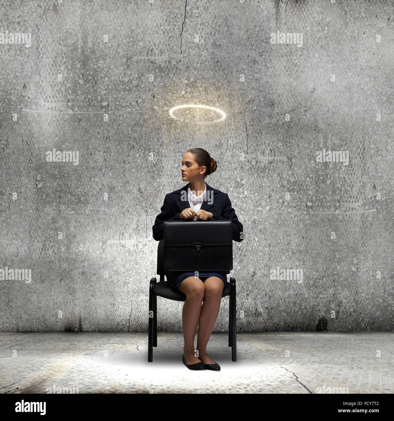 Young crying businesswoman with halo above head Stock Photo - Alamy