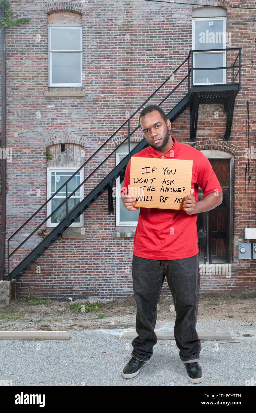 Man holding up a sign that says If You Dont Ask The Answer Will Be No ...