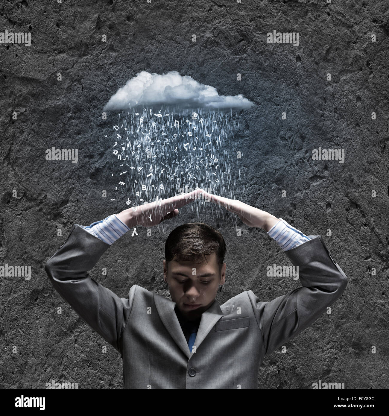 Businessman sitting under rain protecting head with arms Stock Photo ...