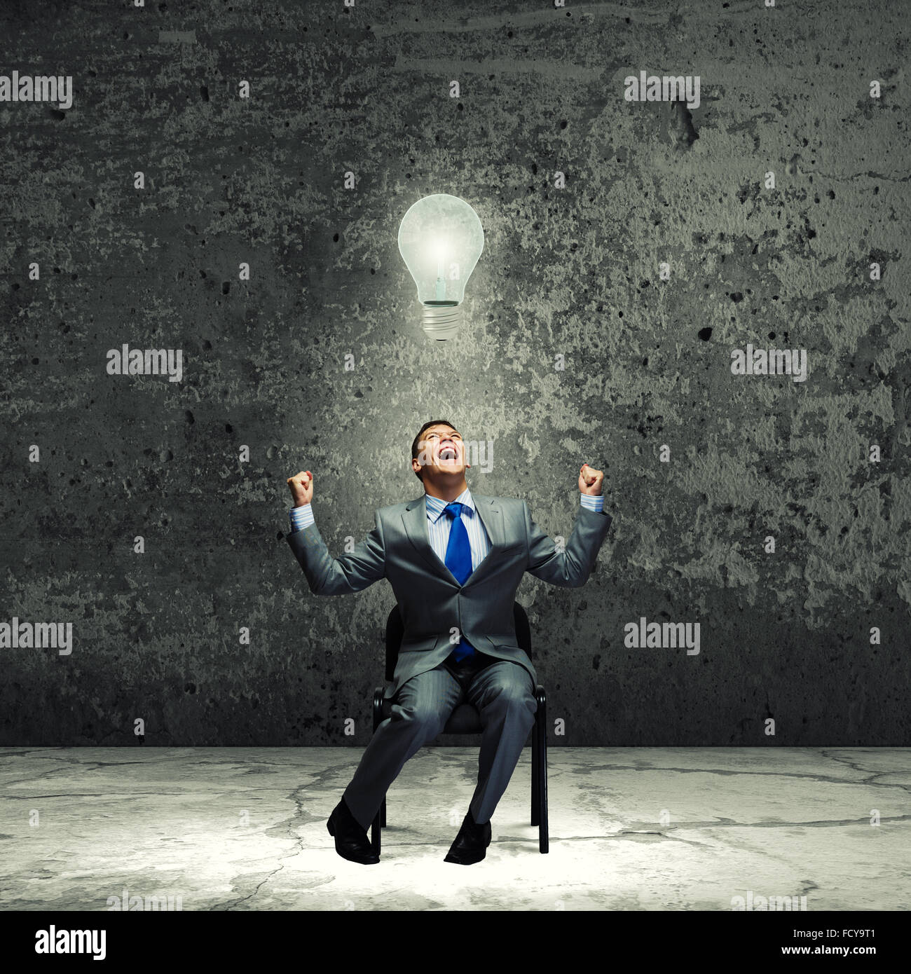 Young businessman sitting on chair and screaming Stock Photo - Alamy