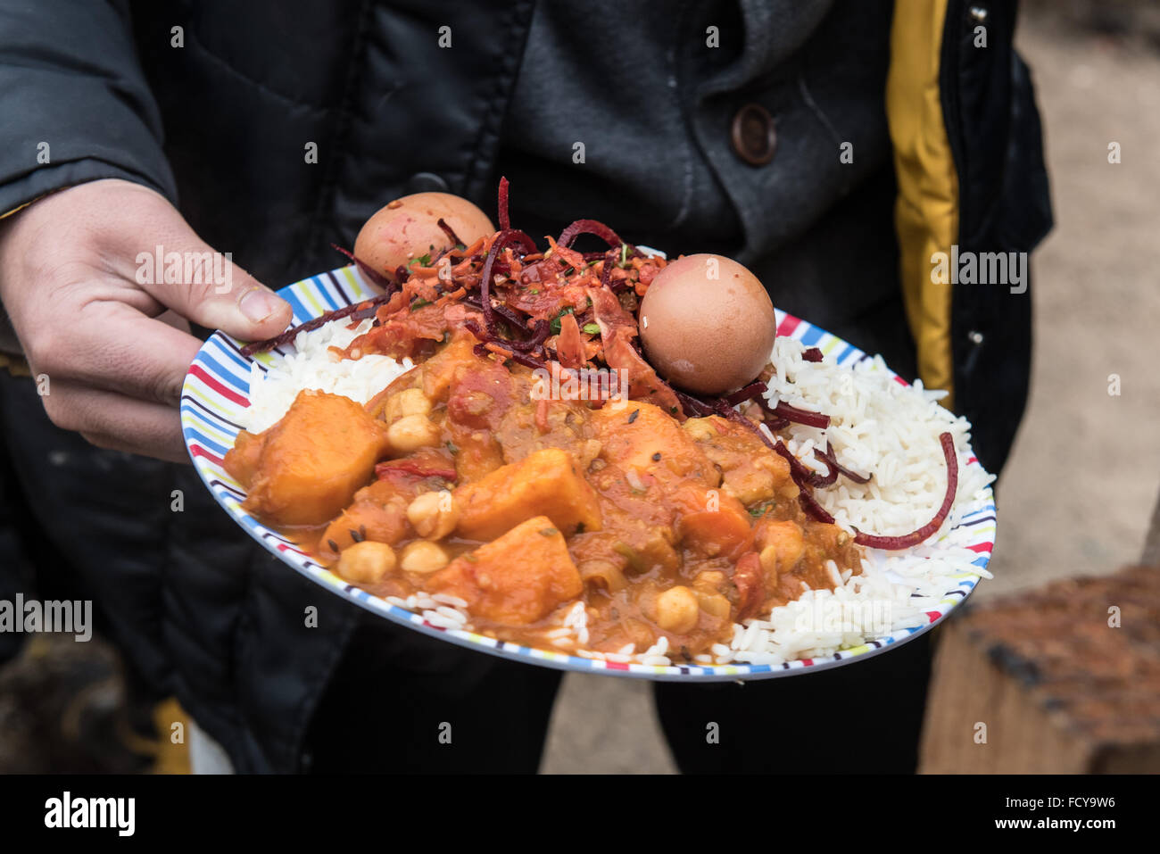 A plate of food cooked by Refugee Community Kitchen is served at Alice ...