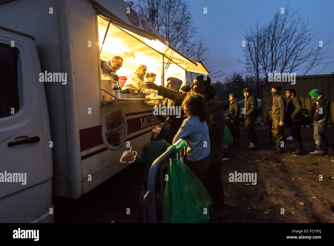 The queue for food as Refugee Community Kitchen food van delivers meals ...