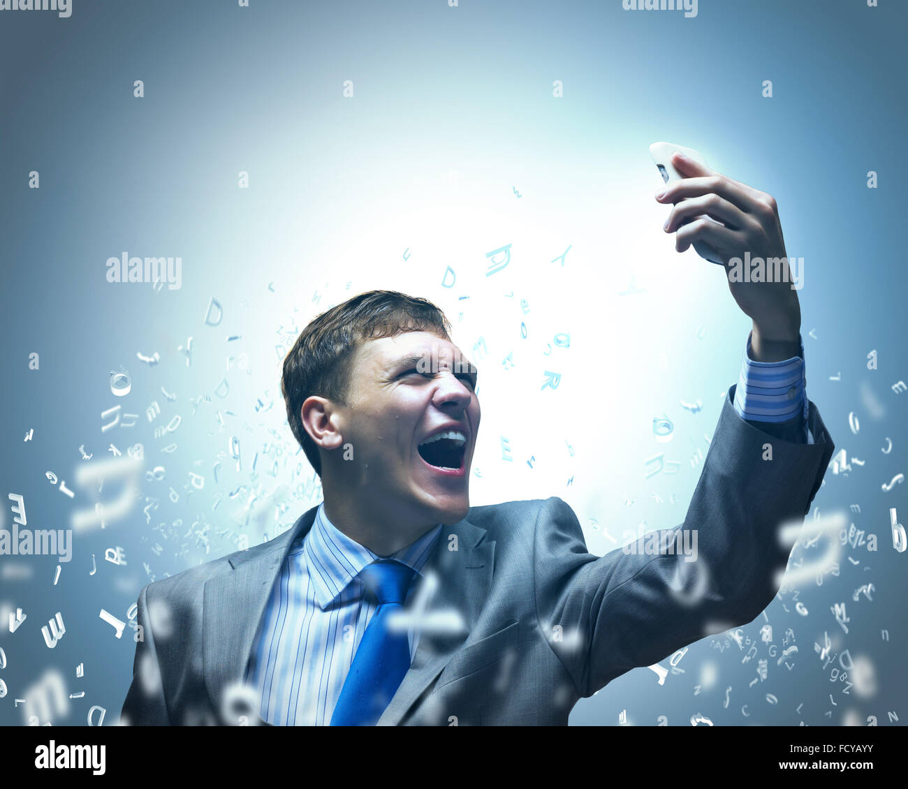 Angry businessman screaming furiously in to mobile phone Stock Photo ...