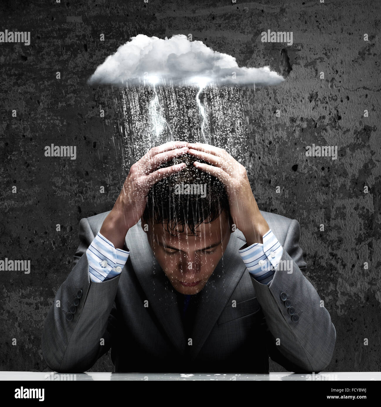 Sad man sitting under rain hi-res stock photography and images - Alamy