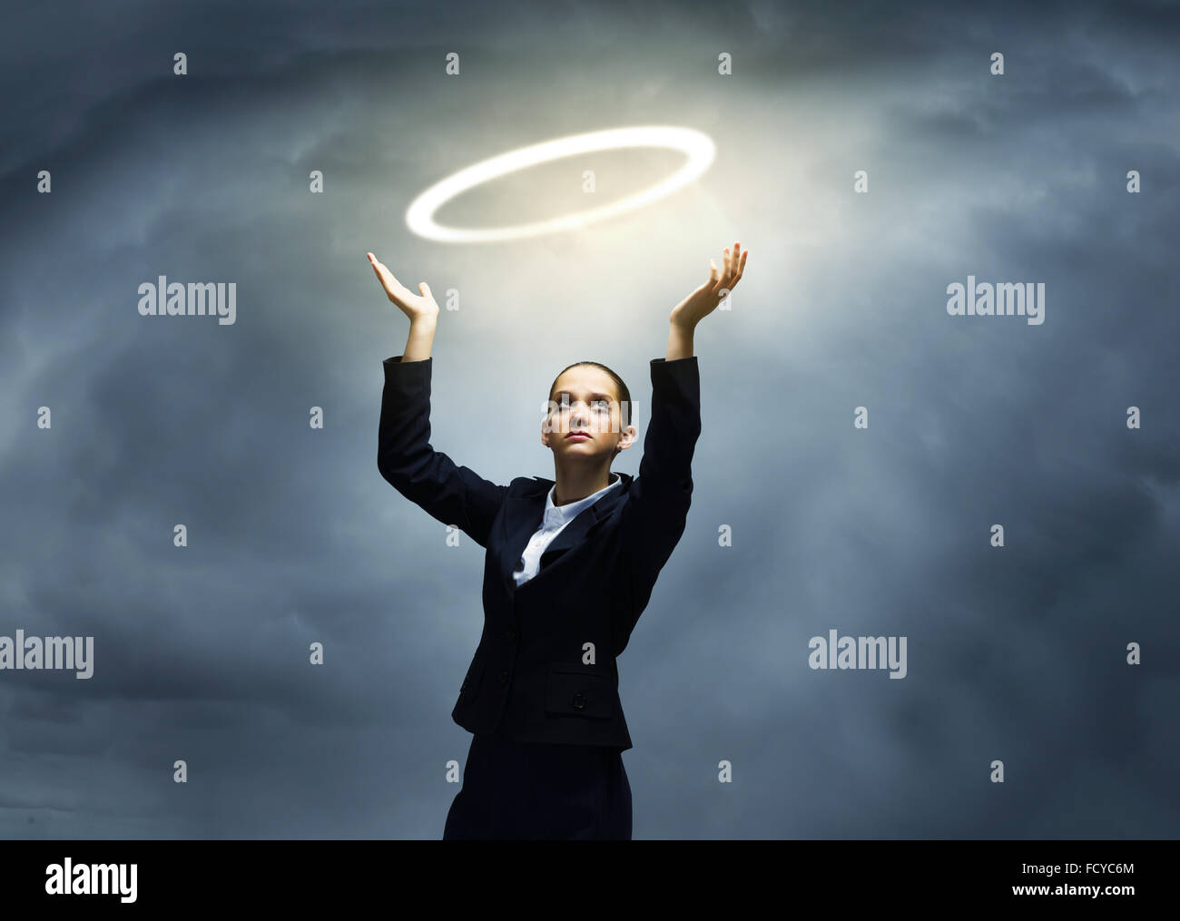 Young crying businesswoman with halo above head Stock Photo - Alamy