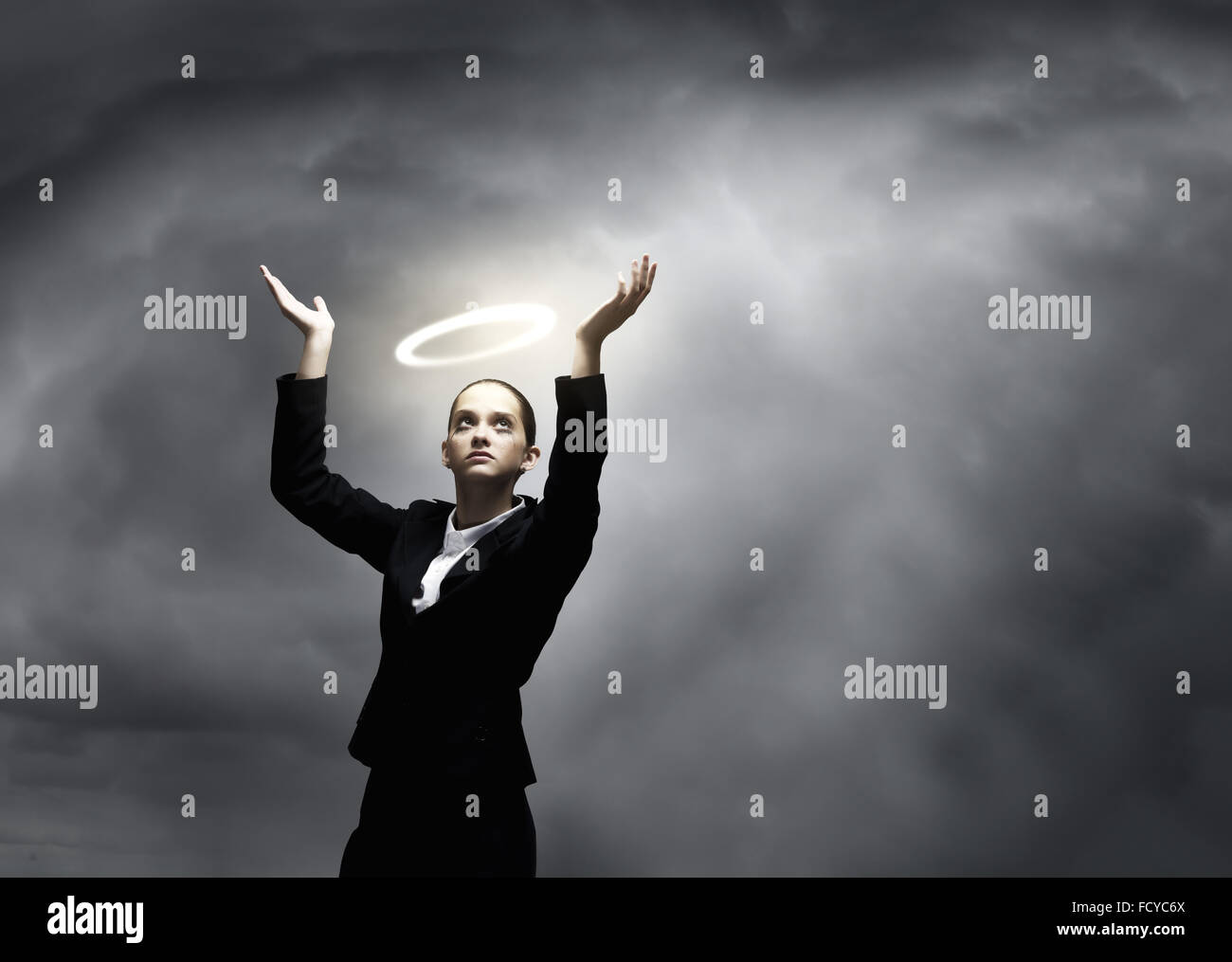 Young crying businesswoman with halo above head Stock Photo - Alamy
