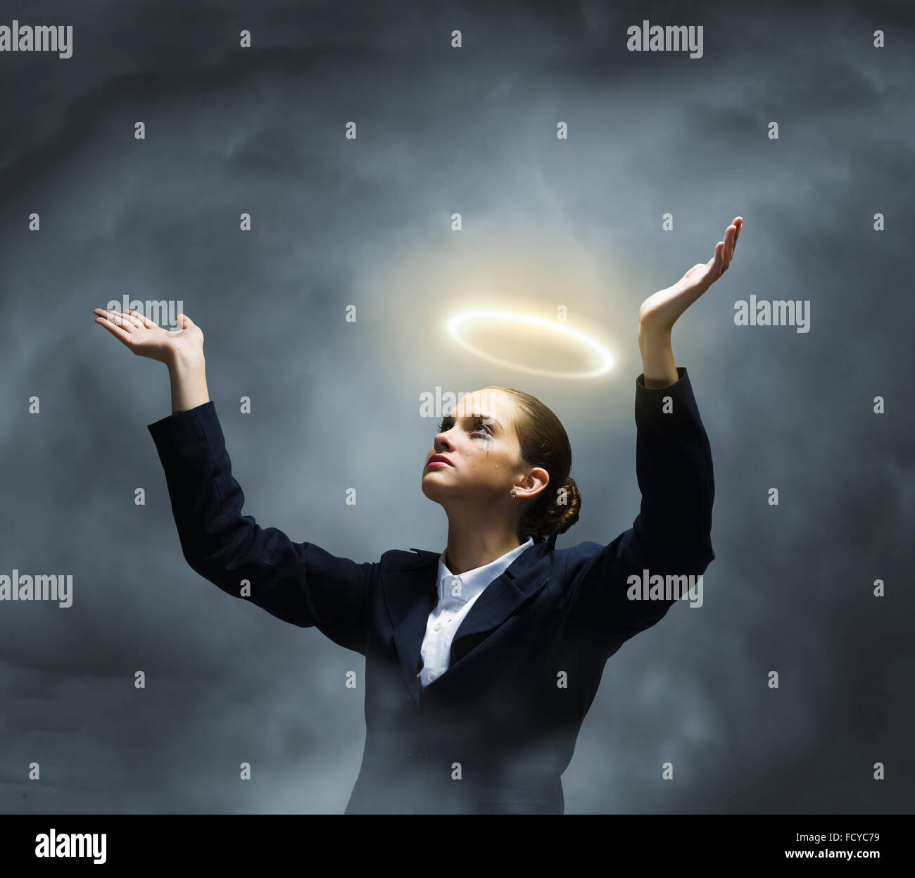 Young crying businesswoman with halo above head Stock Photo - Alamy
