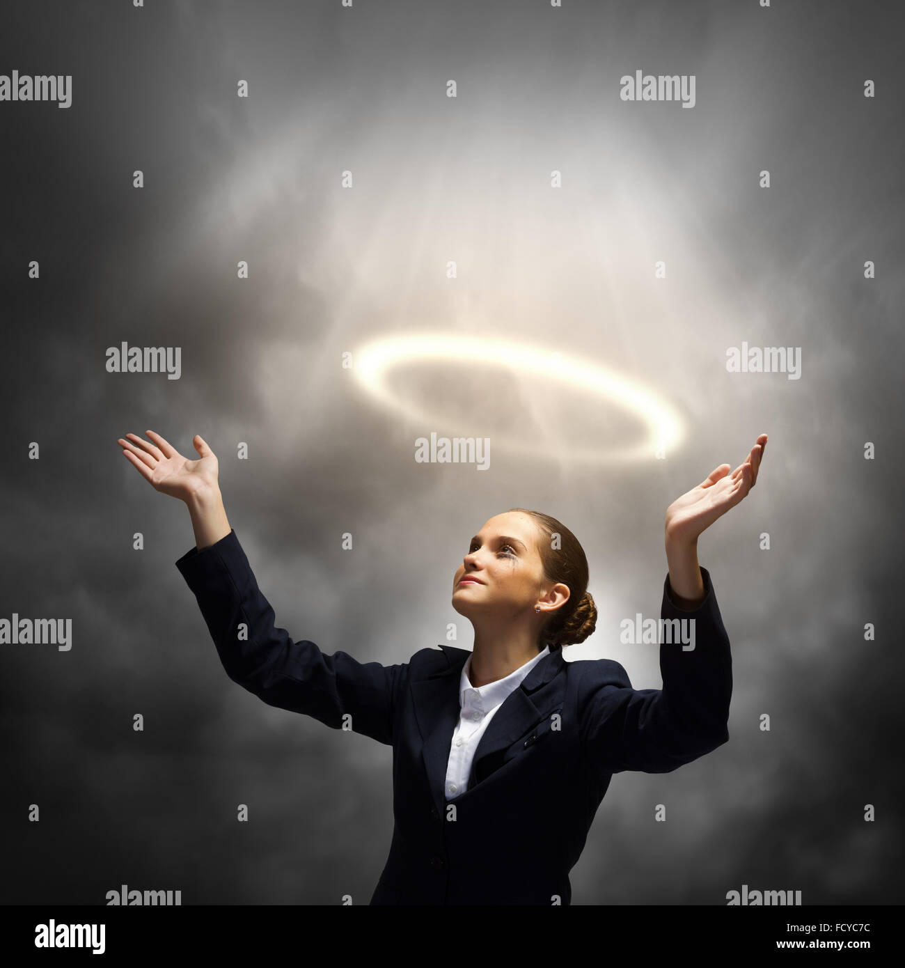 Young crying businesswoman with halo above head Stock Photo - Alamy