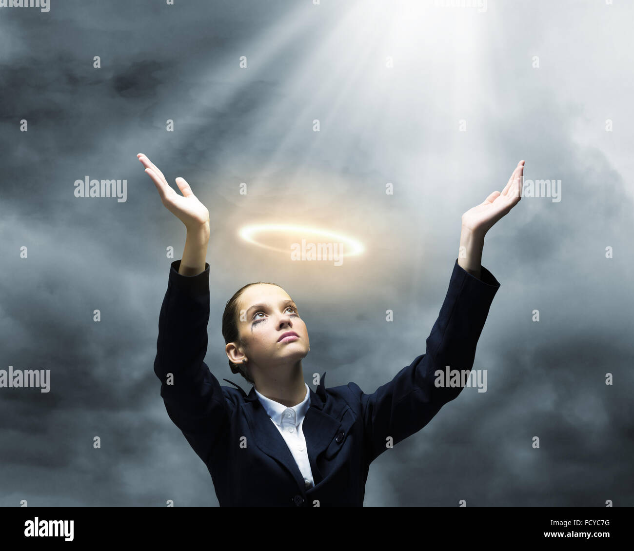 Young crying businesswoman with halo above head Stock Photo - Alamy