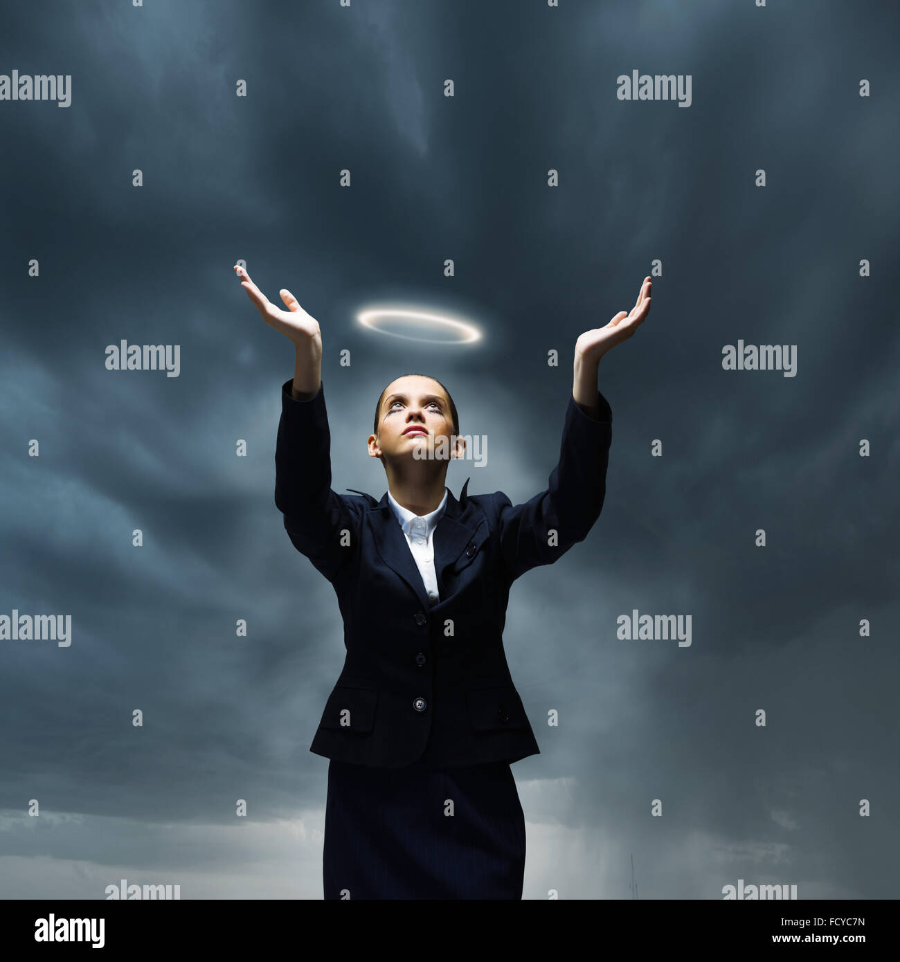 Young crying businesswoman with halo above head Stock Photo - Alamy