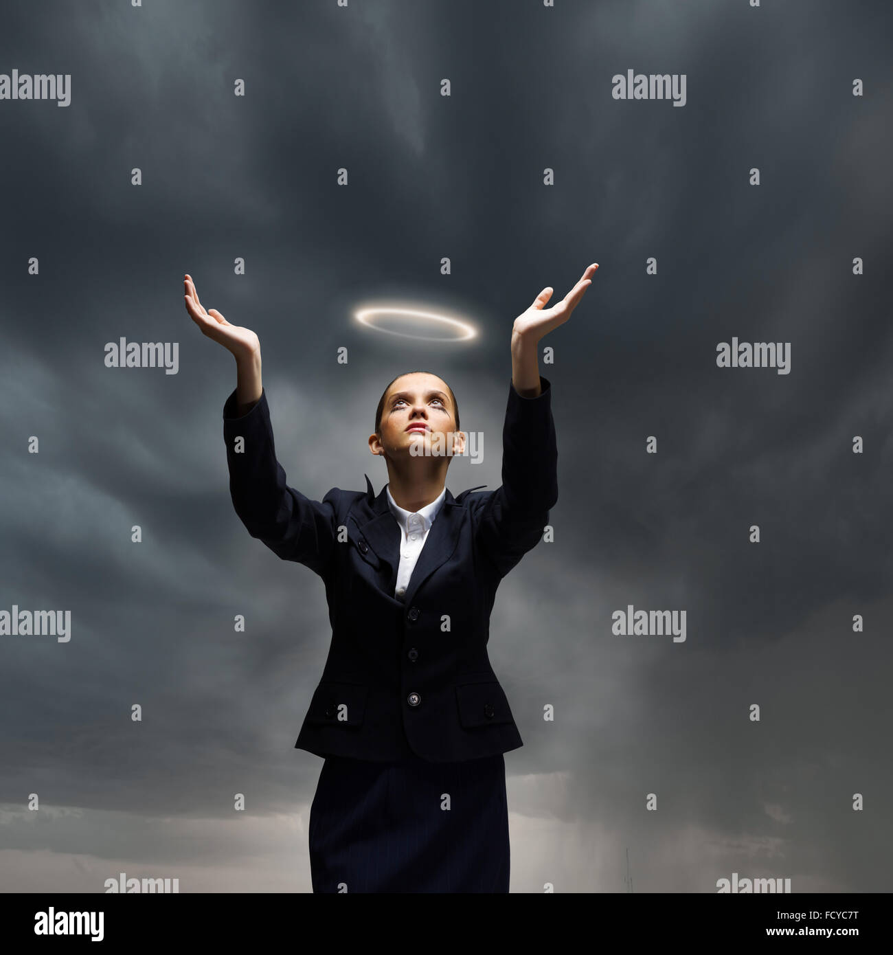 Young crying businesswoman with halo above head Stock Photo - Alamy