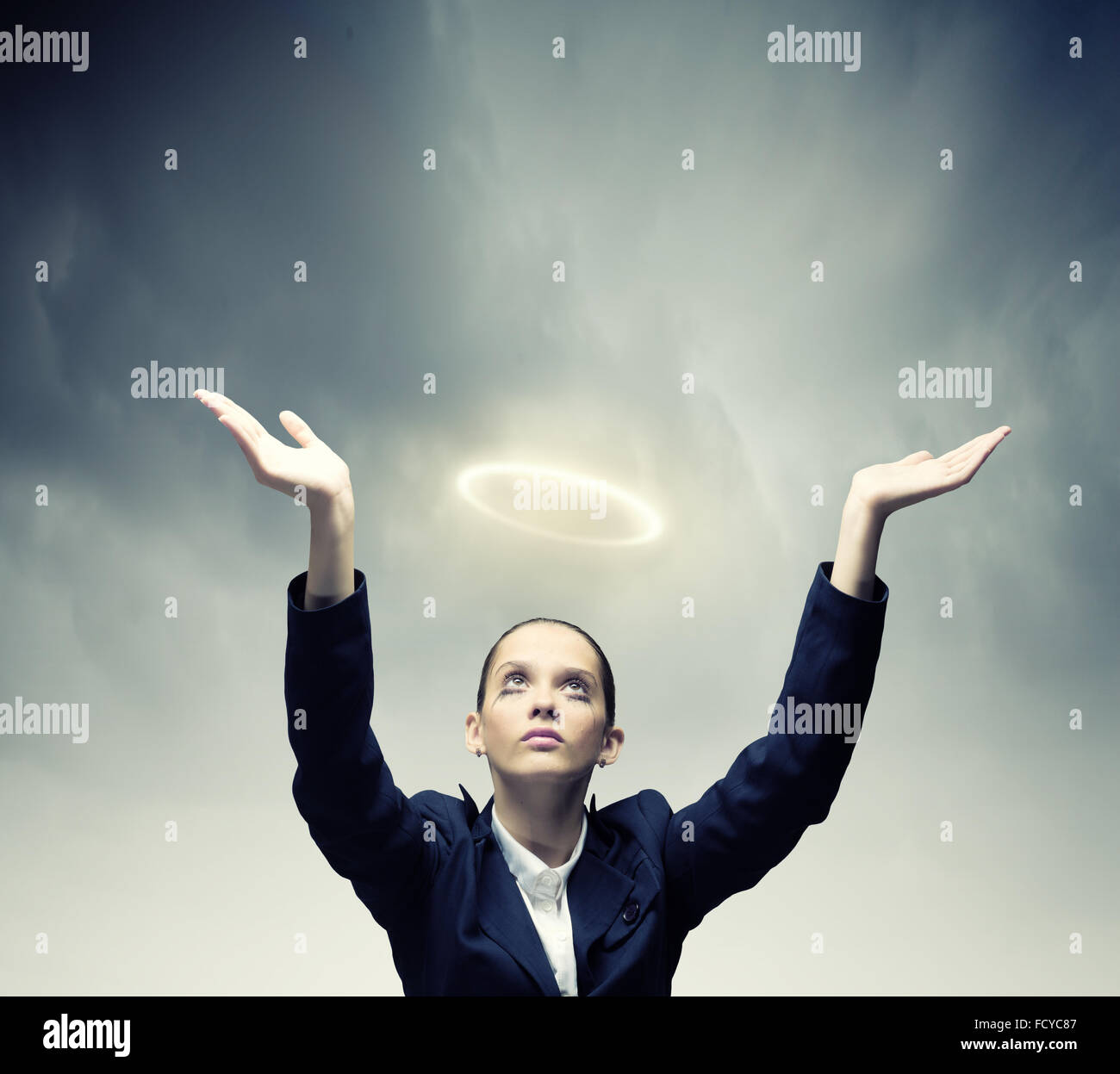 Young crying businesswoman with halo above head Stock Photo - Alamy