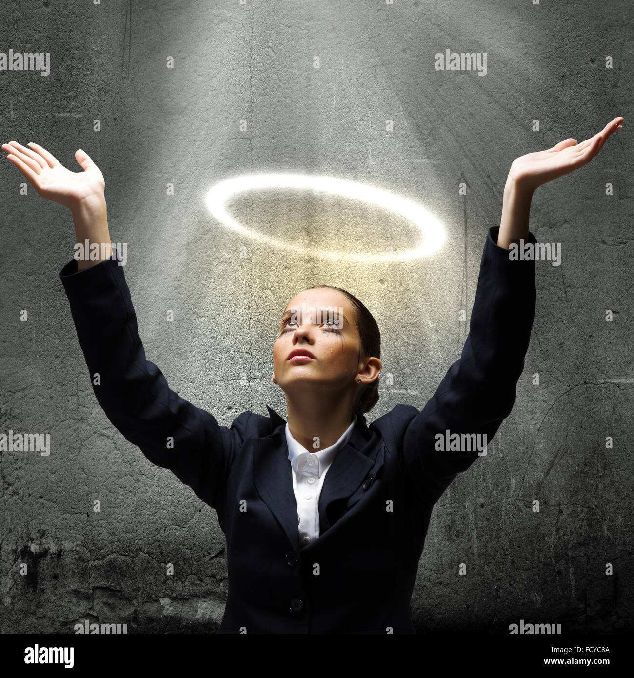 Young crying businesswoman with halo above head Stock Photo - Alamy