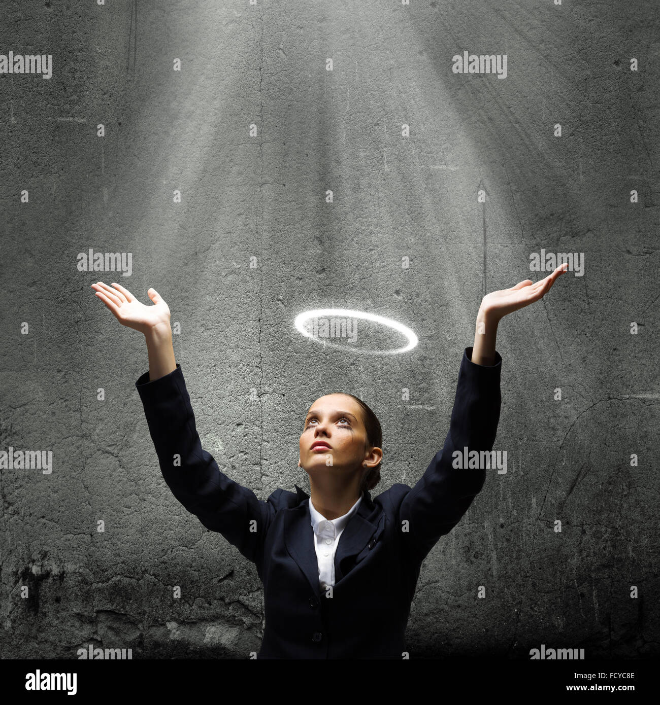 Young crying businesswoman with halo above head Stock Photo - Alamy