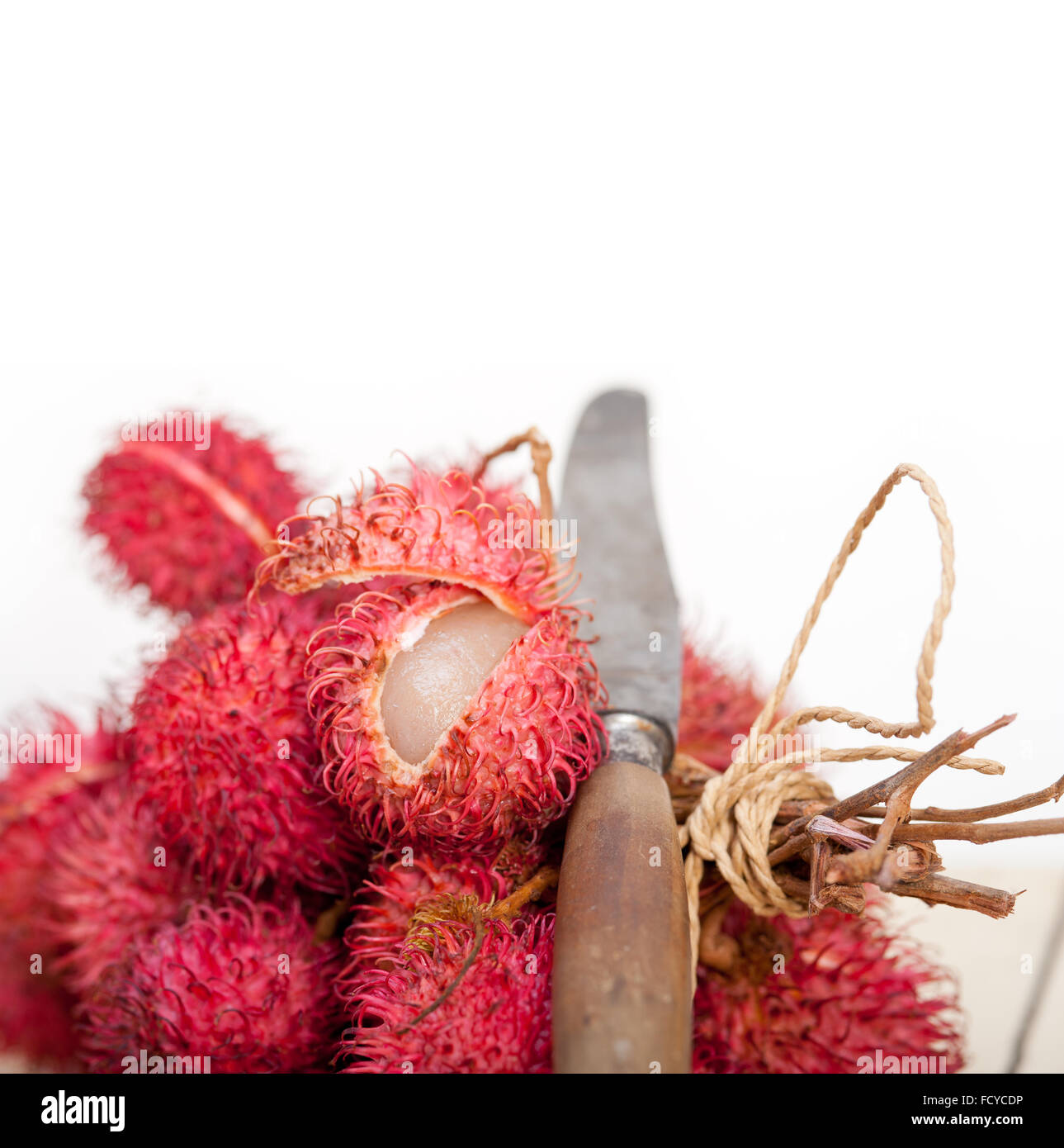 fresh tropical rambutan fruits over rustic wood table Stock Photo - Alamy
