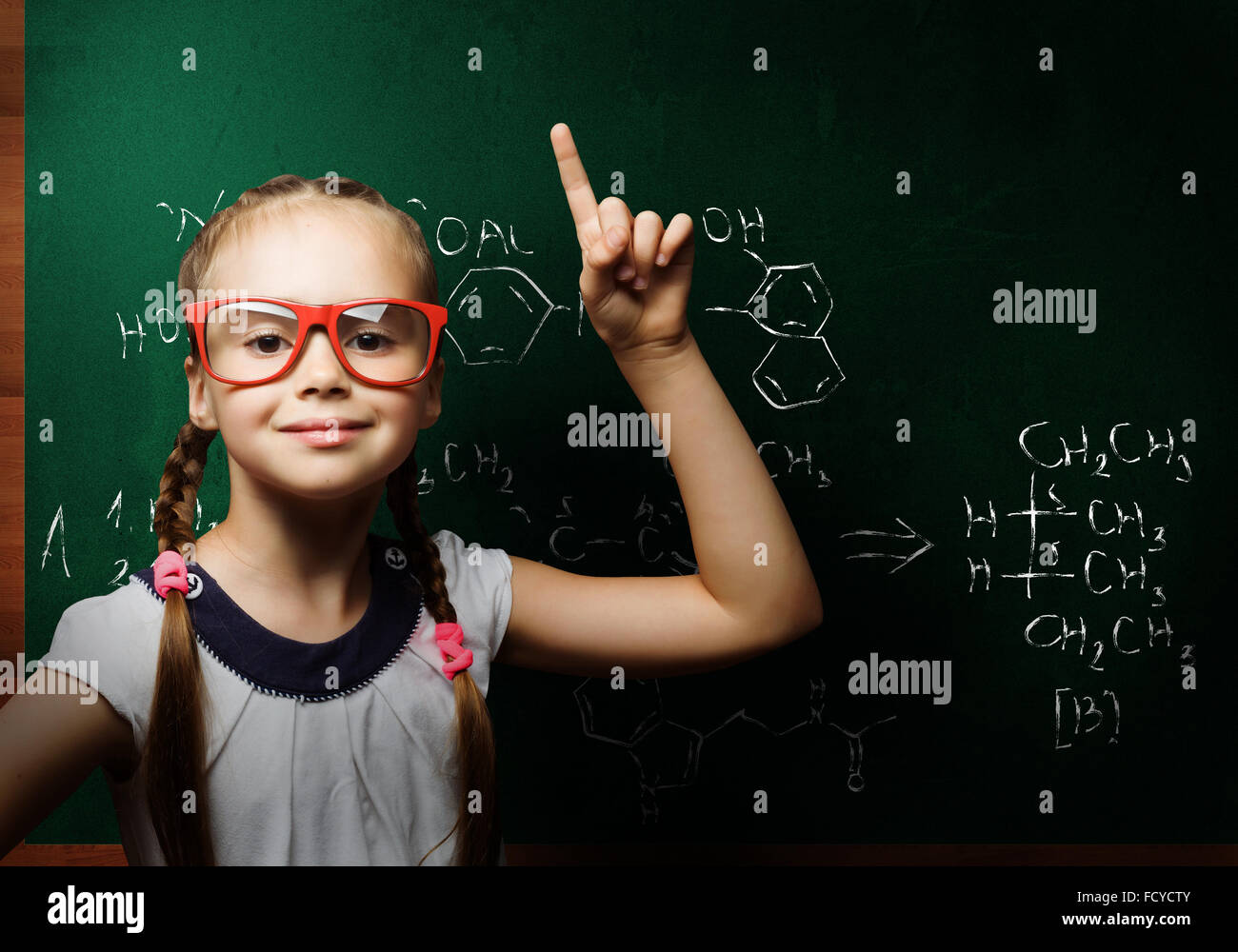 Genius girl in red glasses near blackboard with formulas Stock Photo ...
