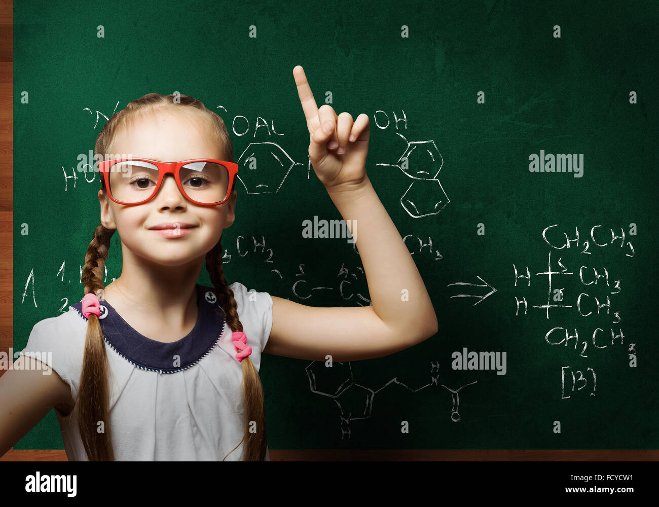 Genius girl in red glasses near blackboard with formulas Stock Photo ...