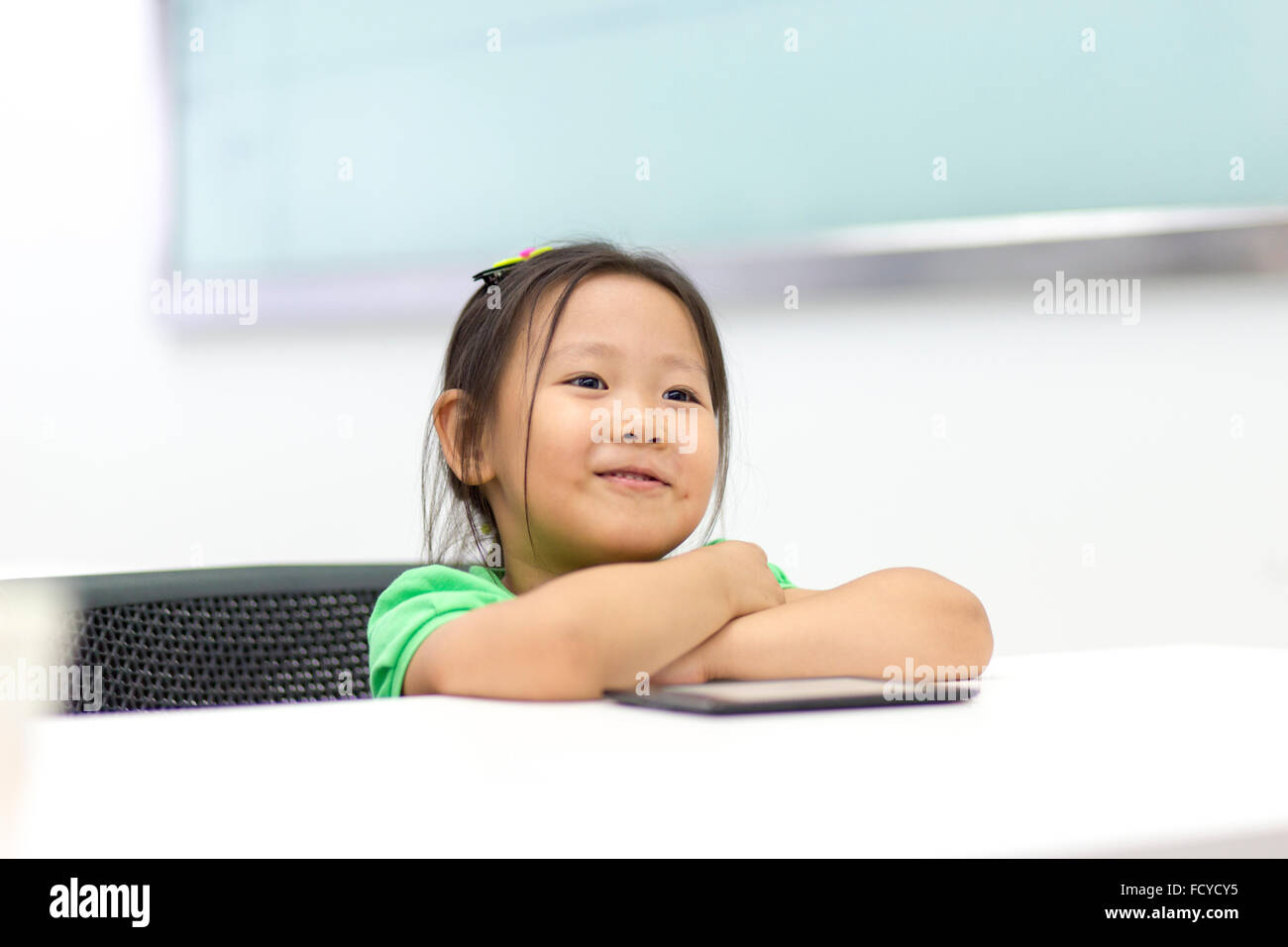 Curious student studying using digital tablet at classroom Stock Photo ...