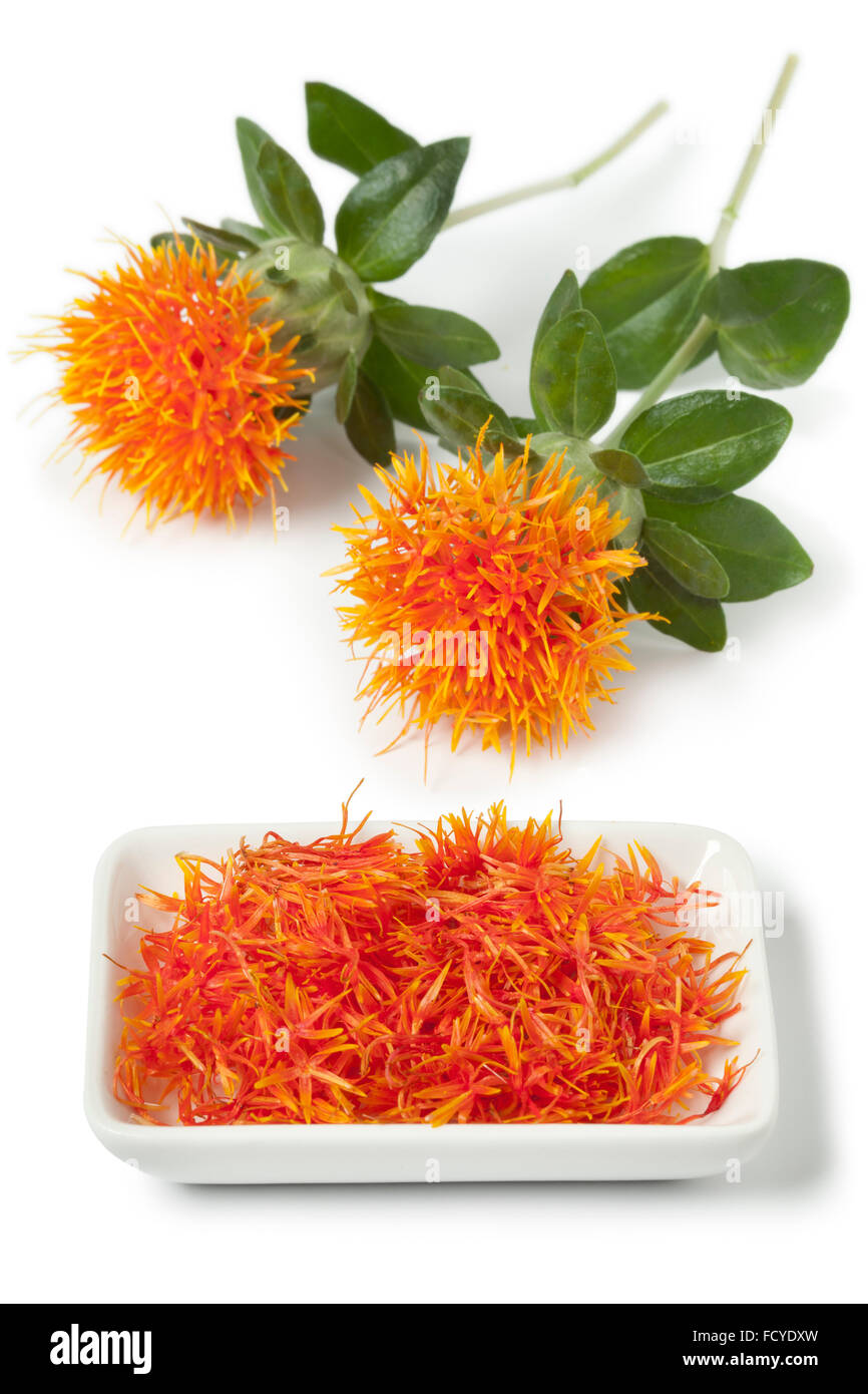 Dish with imitation Saffron from safflower on white background Stock ...