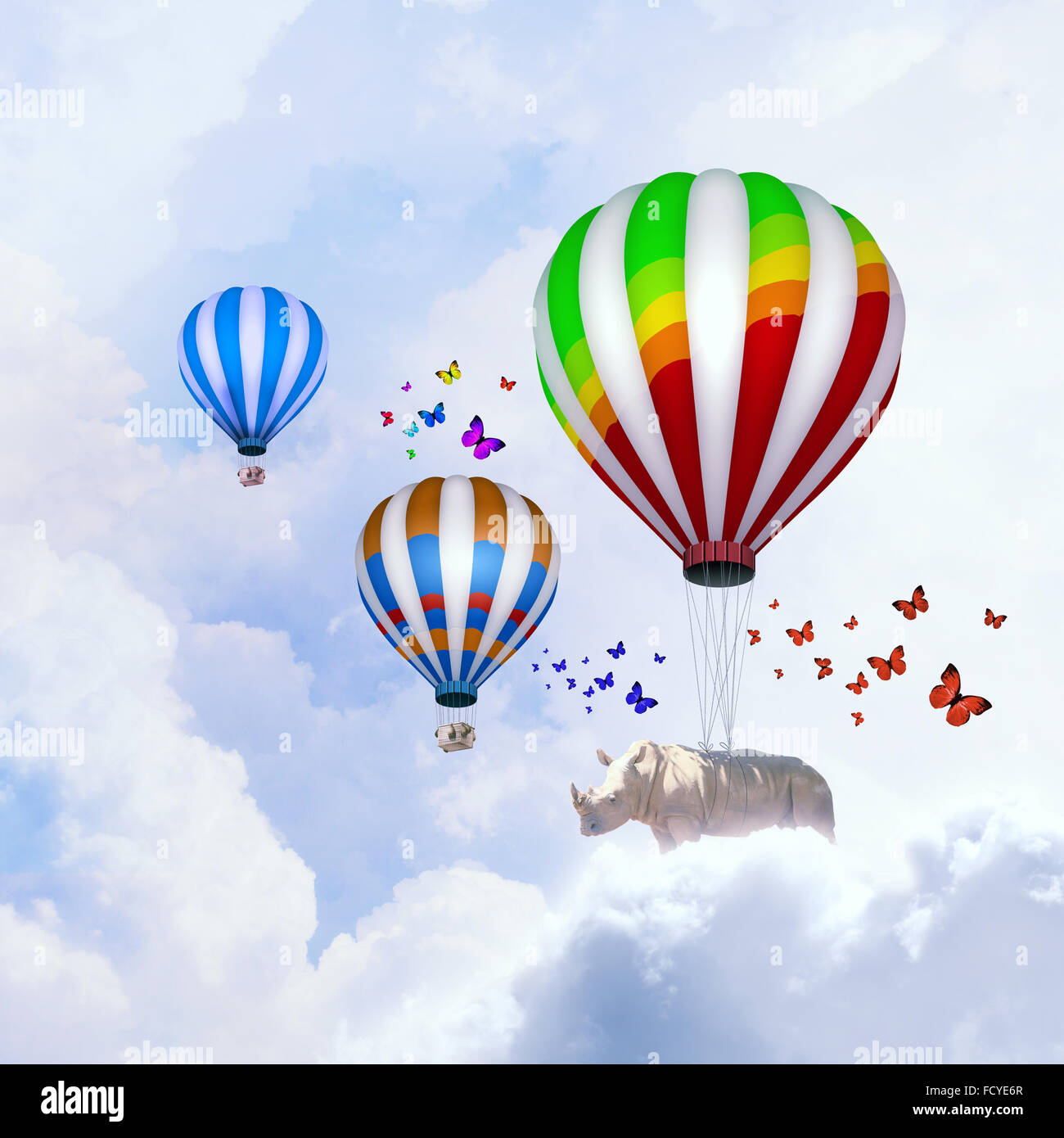 Rhino flying high in sky on colorful aerostat Stock Photo - Alamy