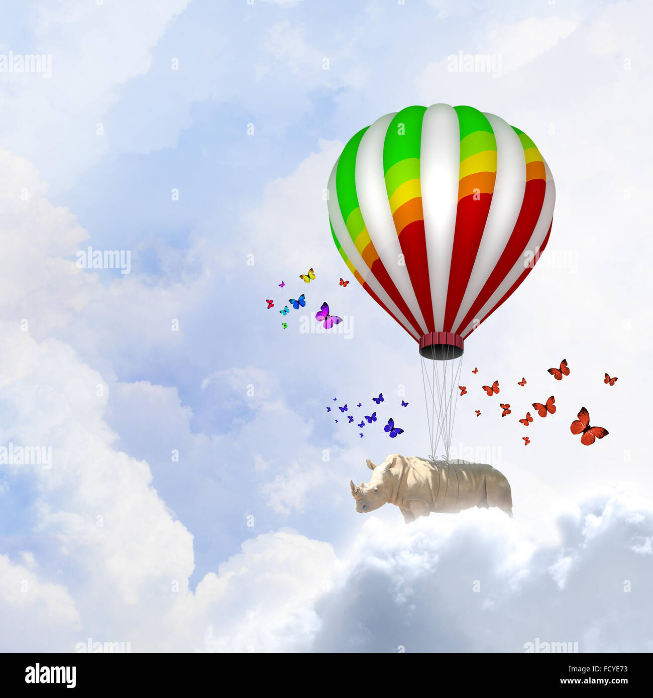Rhino flying high in sky on colorful aerostat Stock Photo - Alamy