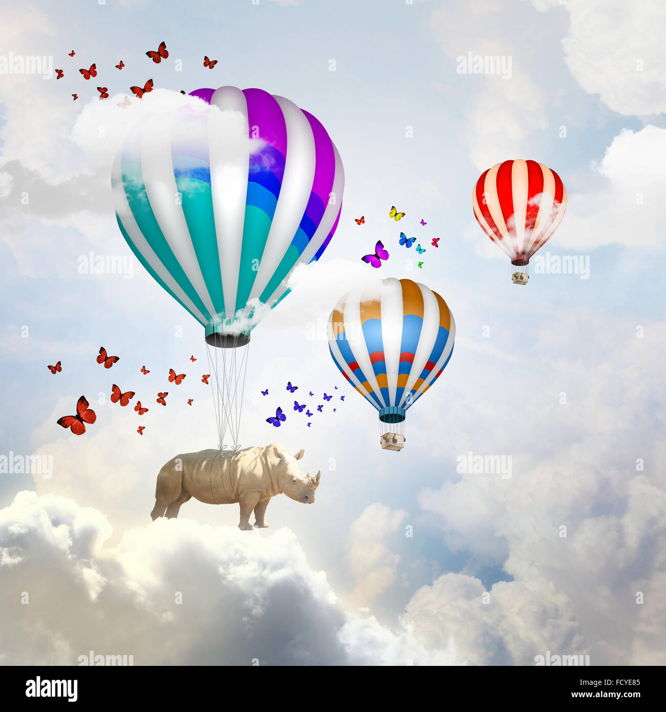 Rhino flying high in sky on colorful aerostat Stock Photo - Alamy