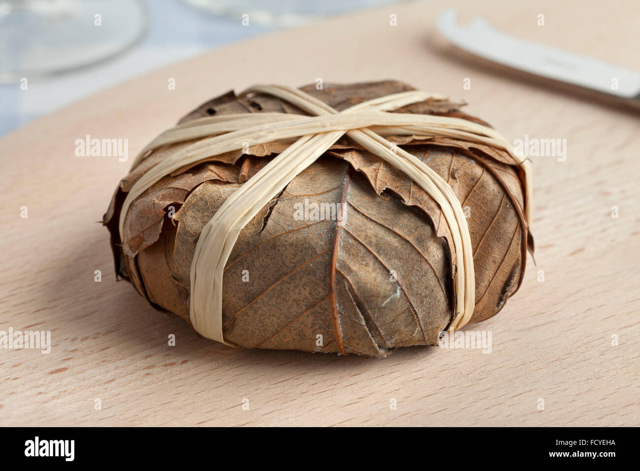 French Banon cheese in chestnut leaves Stock Photo - Alamy