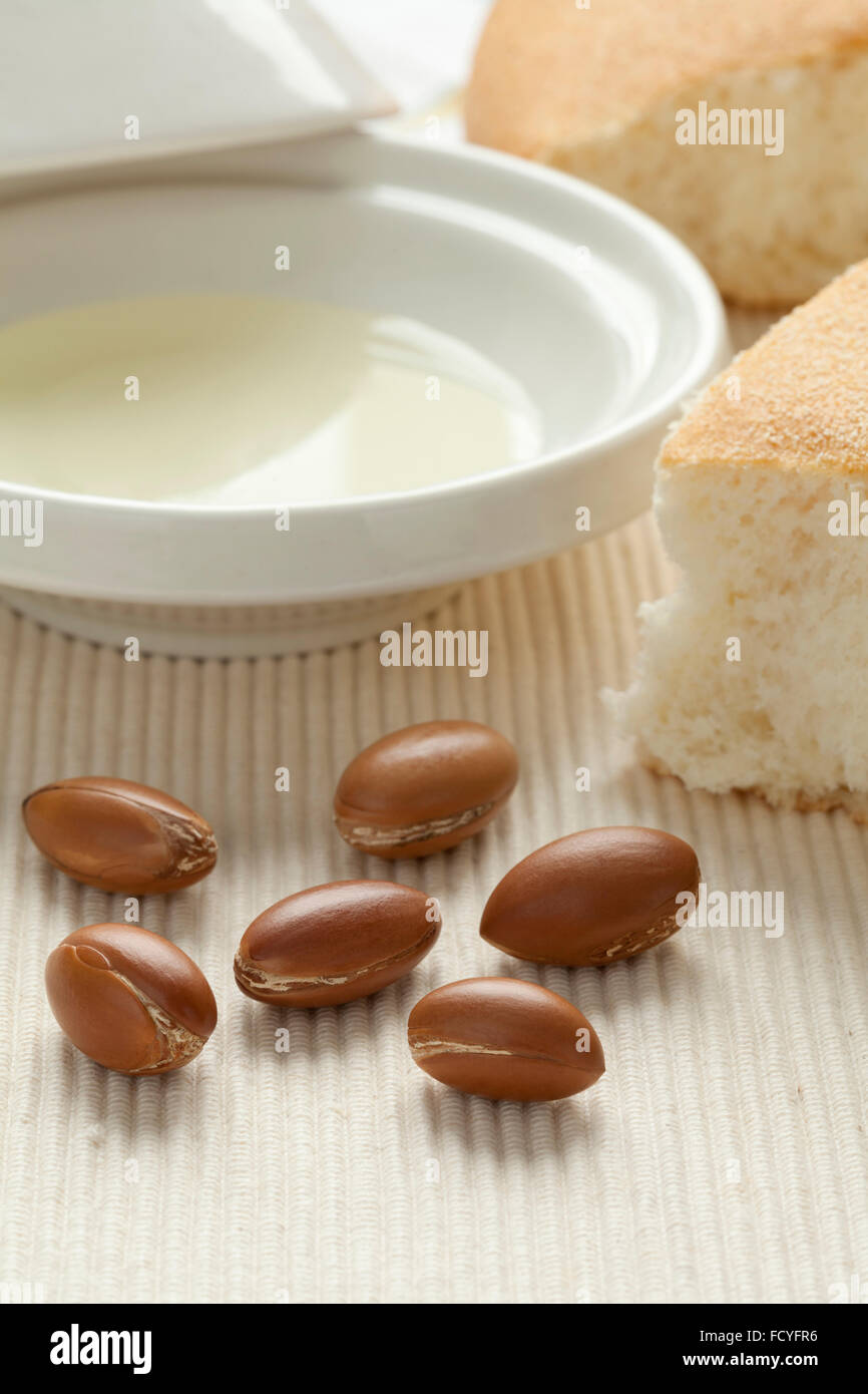 Moroccan argan nuts and oil for dinner Stock Photo - Alamy