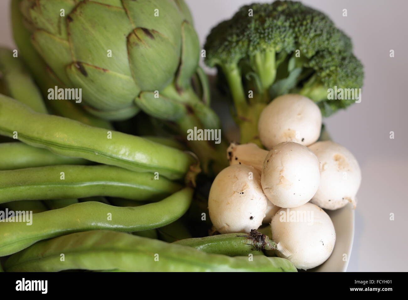 Several vegetables on a plate Stock Photo - Alamy