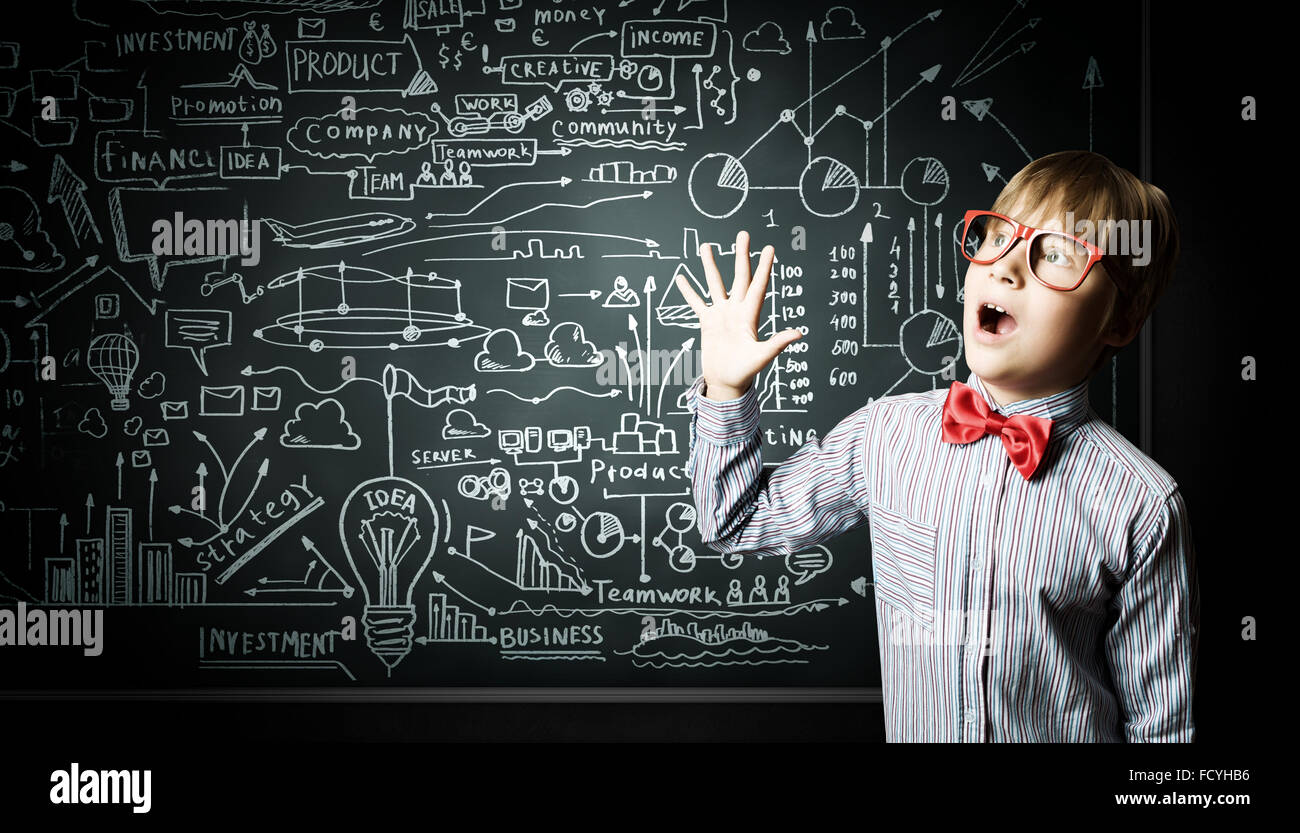 Genius boy in red glasses near blackboard with formulas Stock Photo - Alamy
