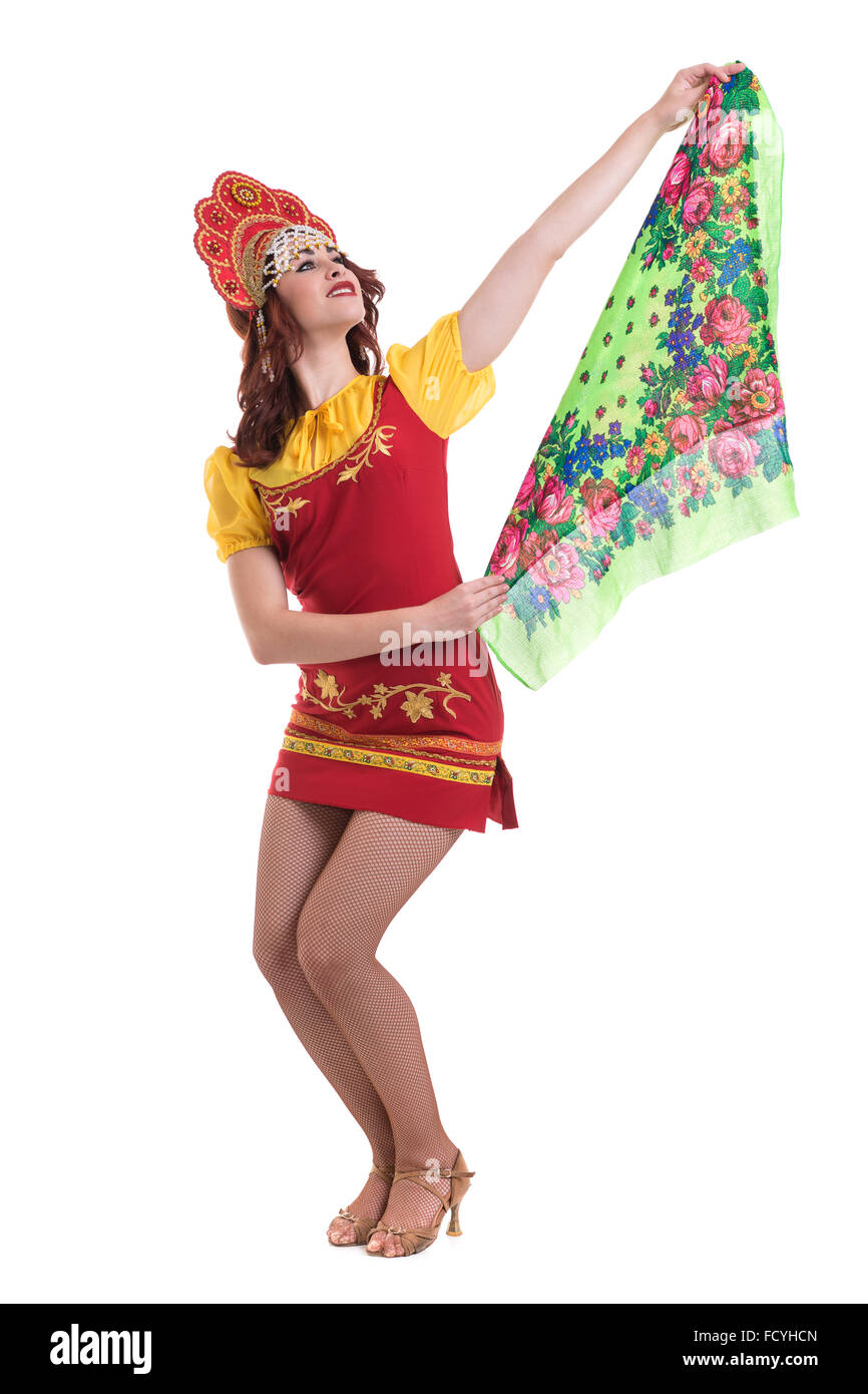 Young woman wearing a folk costumes dancing. Isolated on white in full ...