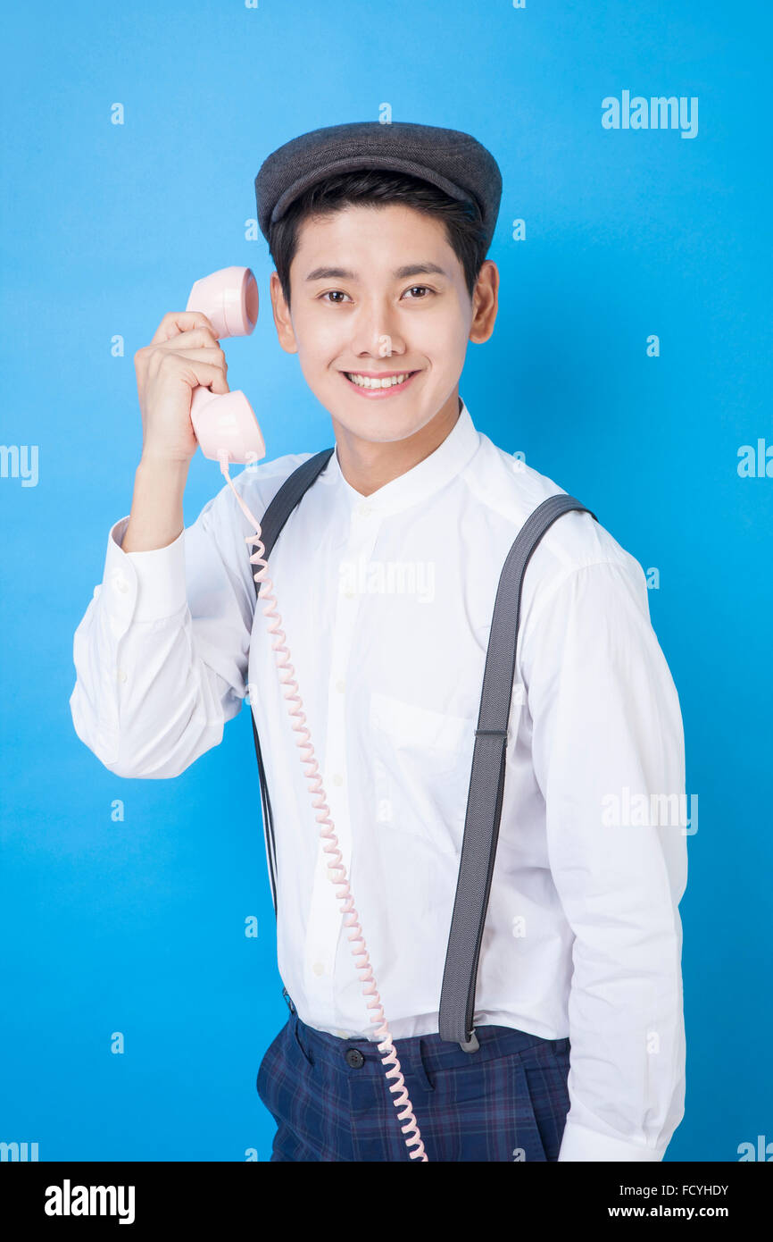 Asian male taking a phone call hi-res stock photography and images - Alamy