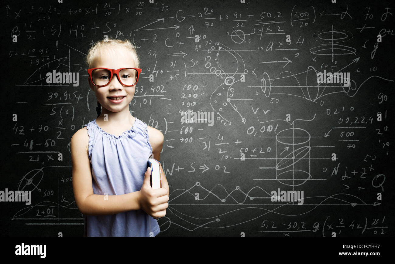 Genius girl in red glasses near blackboard with formulas Stock Photo ...