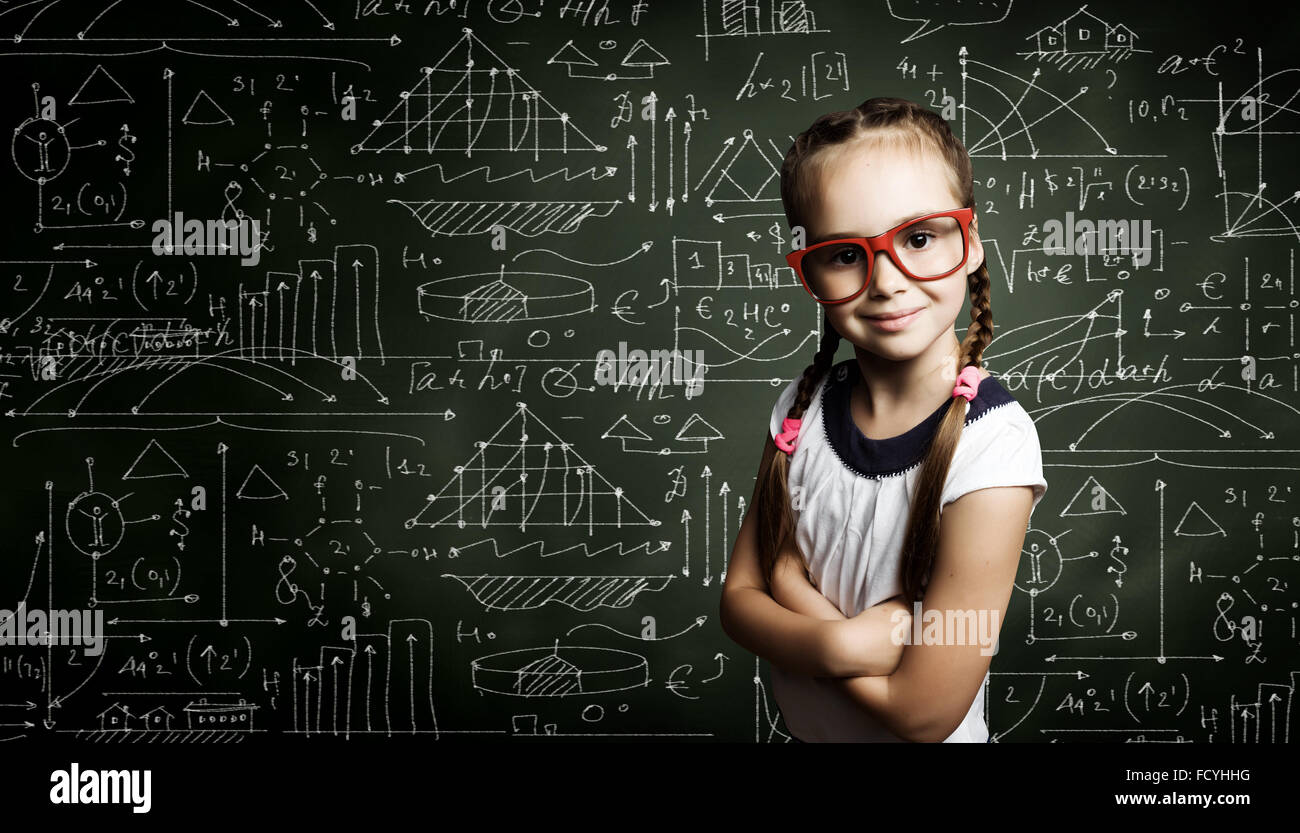 Genius girl in red glasses near blackboard with formulas Stock Photo ...